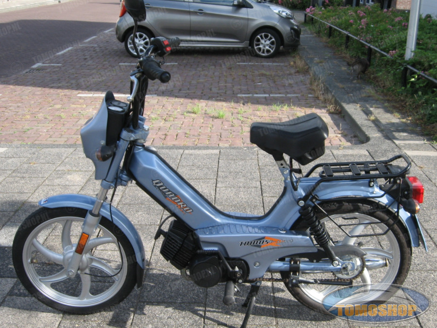 What is this plastic piece on the cargo rack of a tomos/moped? : r/moped